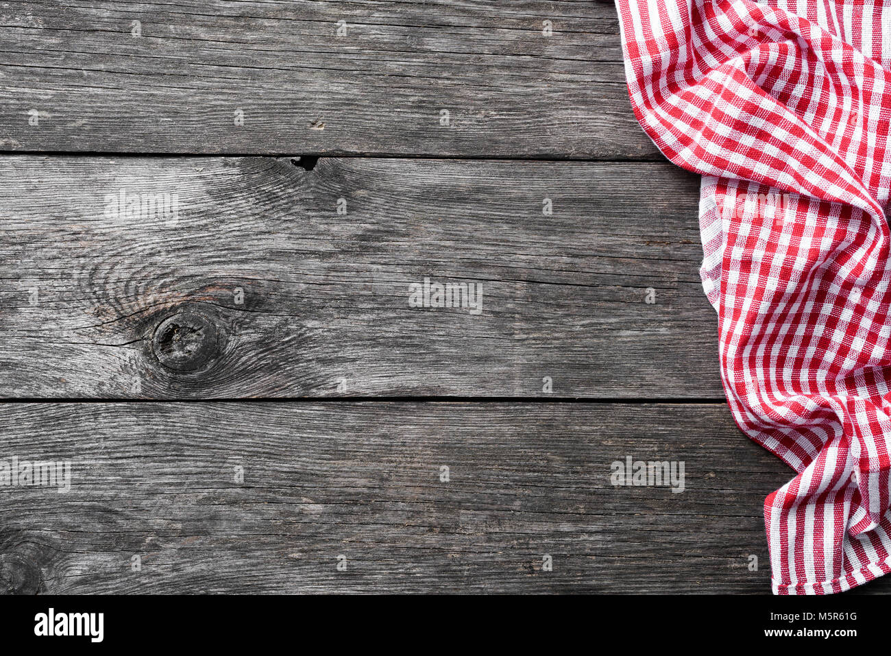 Red checkered textile on rustic wood. Food background with copy space ...