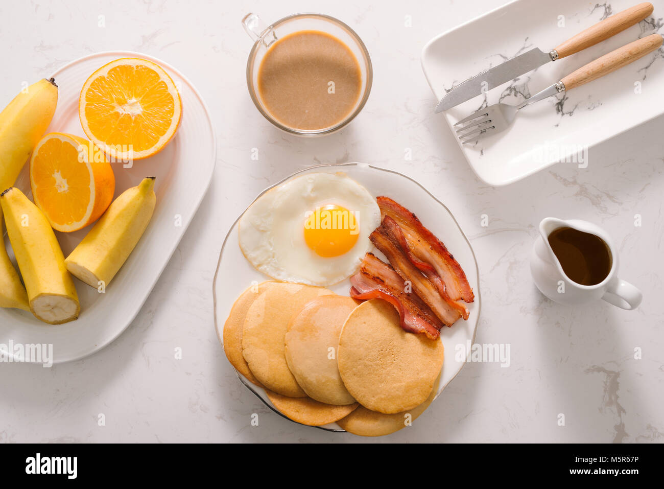 Breakfast plate with pancakes, eggs, bacon and fruit Stock Photo - Alamy