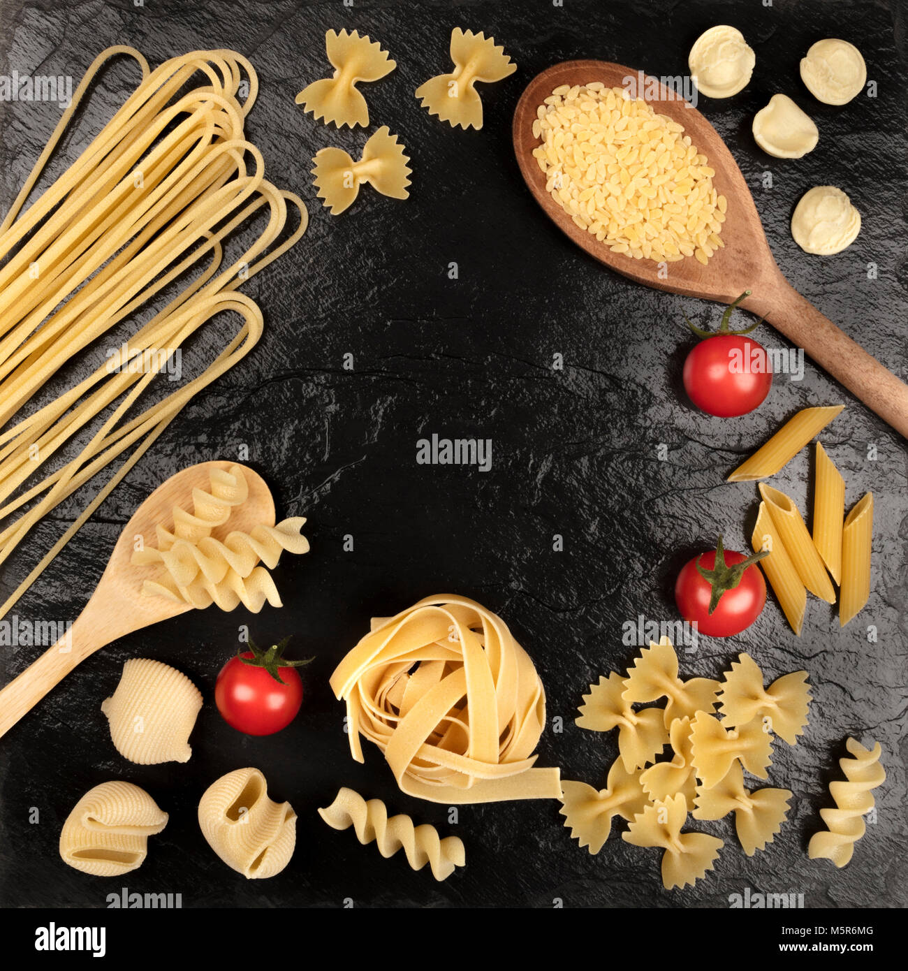Overhead square photo of different types of pasta with cherry tomatoes ...
