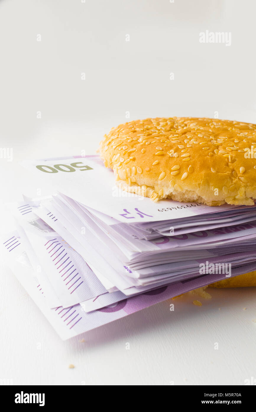 hamburger filled with euro money Stock Photo - Alamy