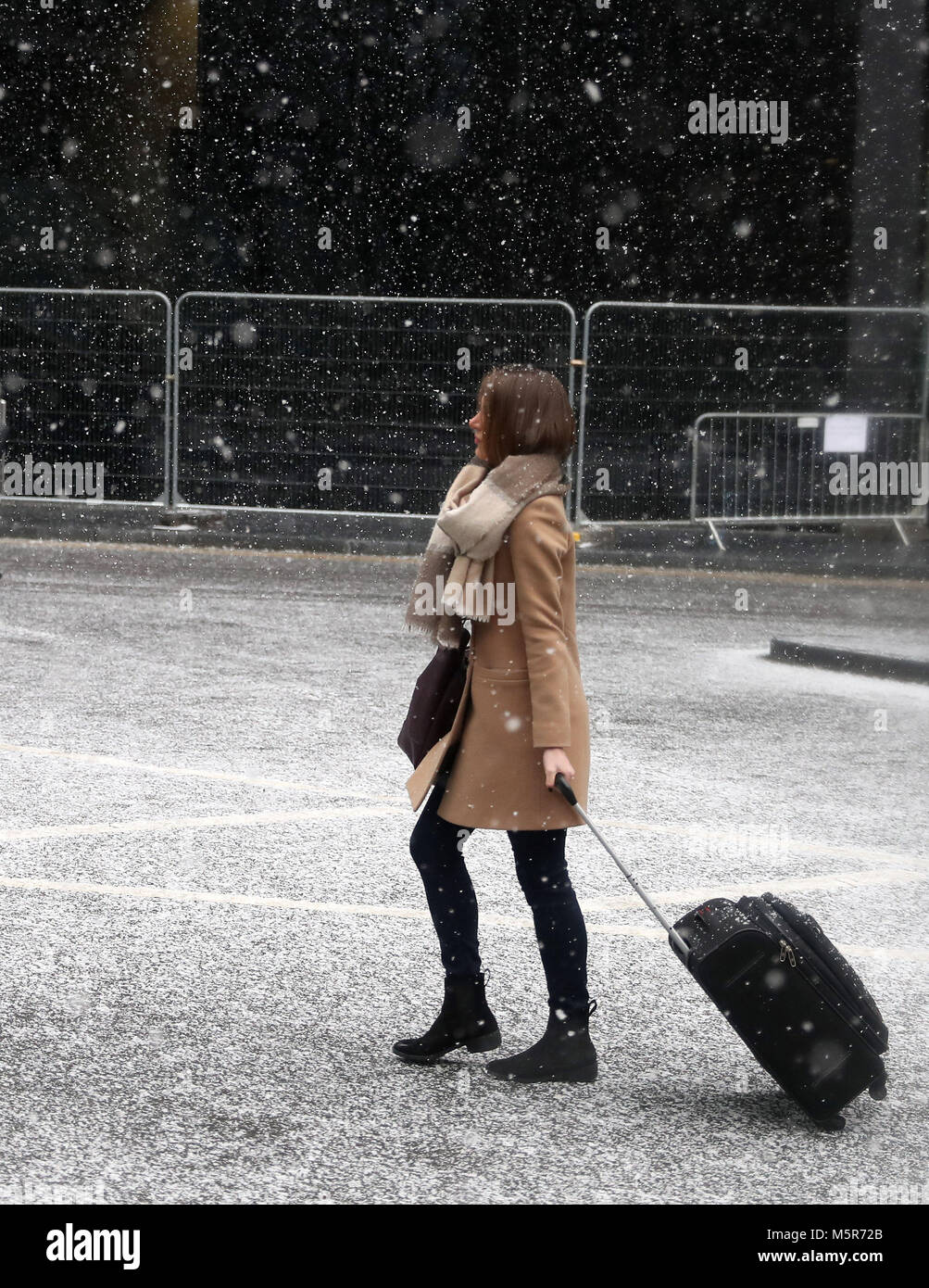 Commuters walking in the snow near London Bridge as some parts of the ...