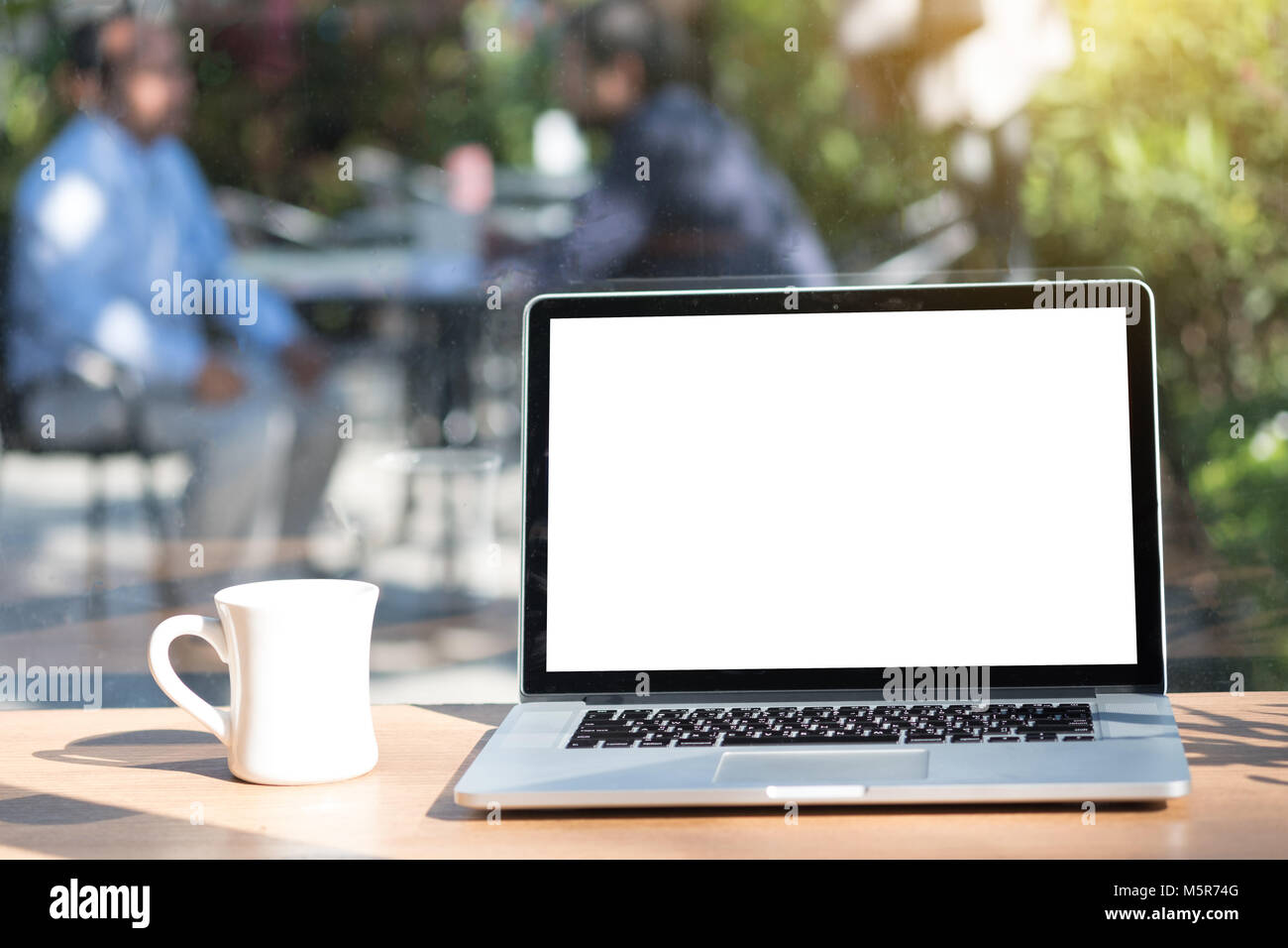 Laptop with blank screen on table. Workspace background new project on ...