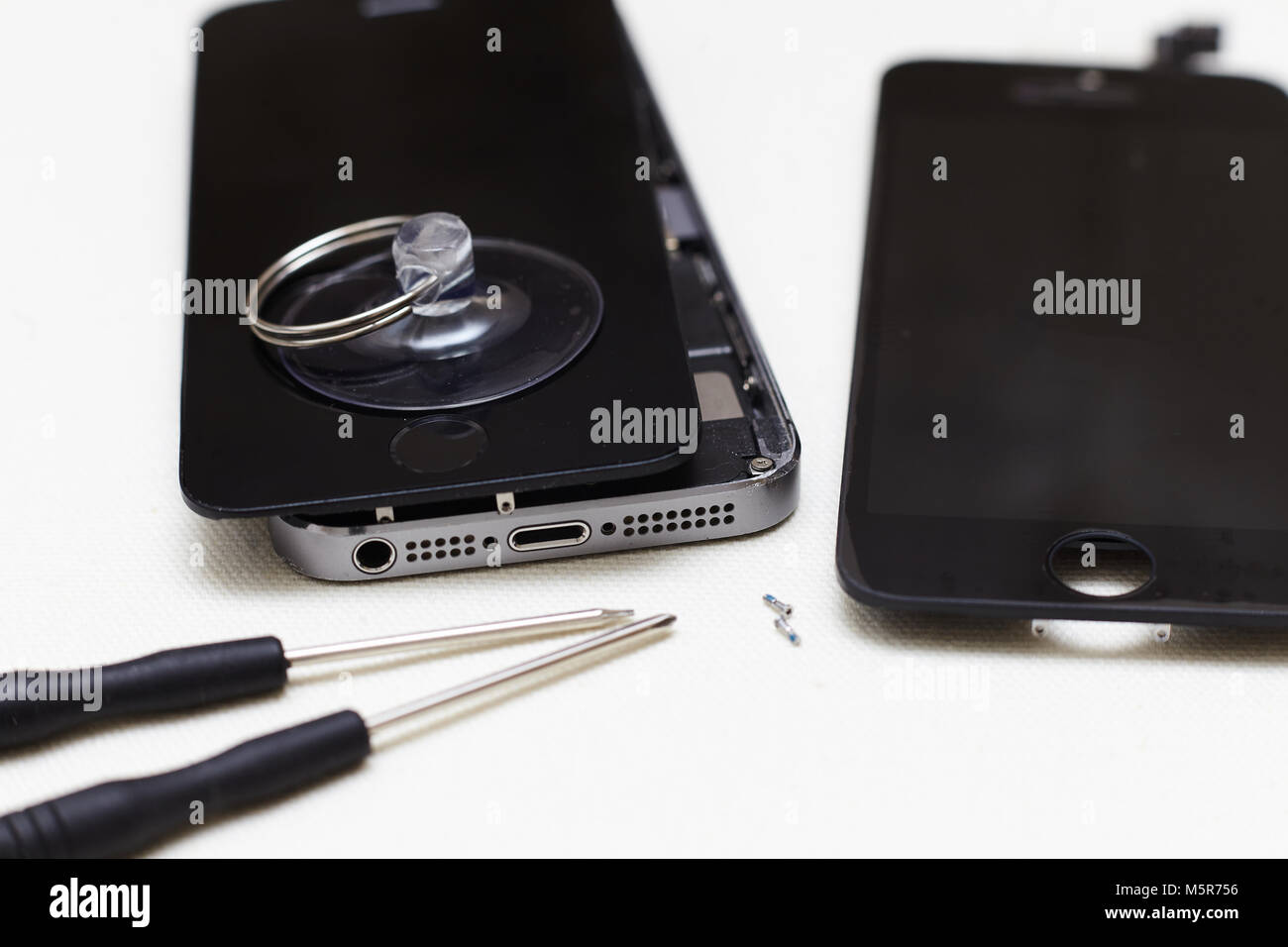 Close-up photos showing process of mobile phone repair, changing the ...