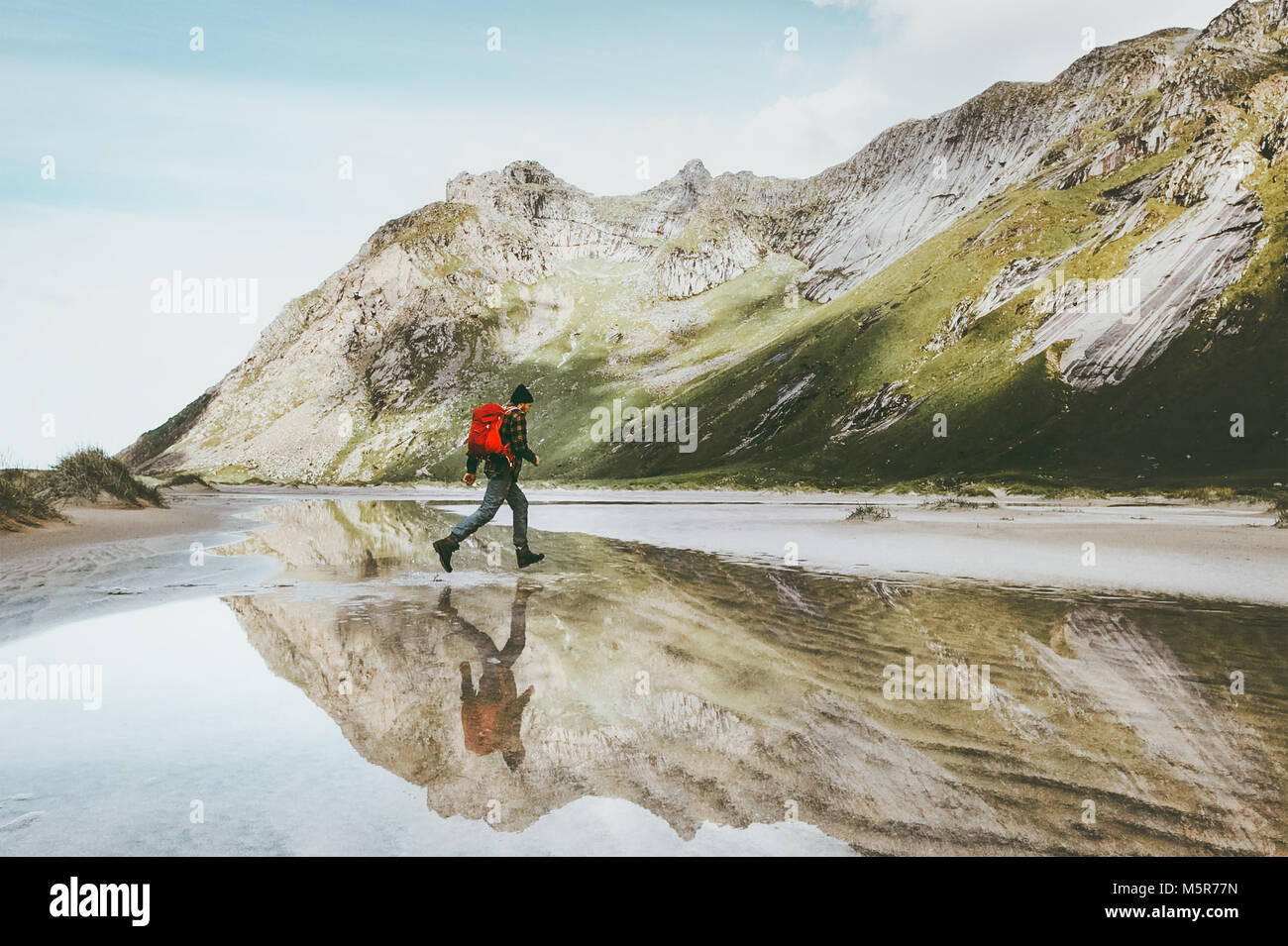 Traveler Man running in mountains Travel lifestyle concept adventure ...