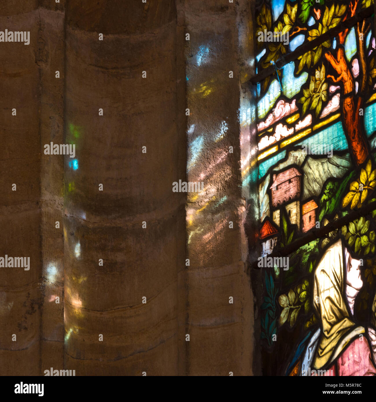 stained glass windows and their reflections on the stone walls of St ...