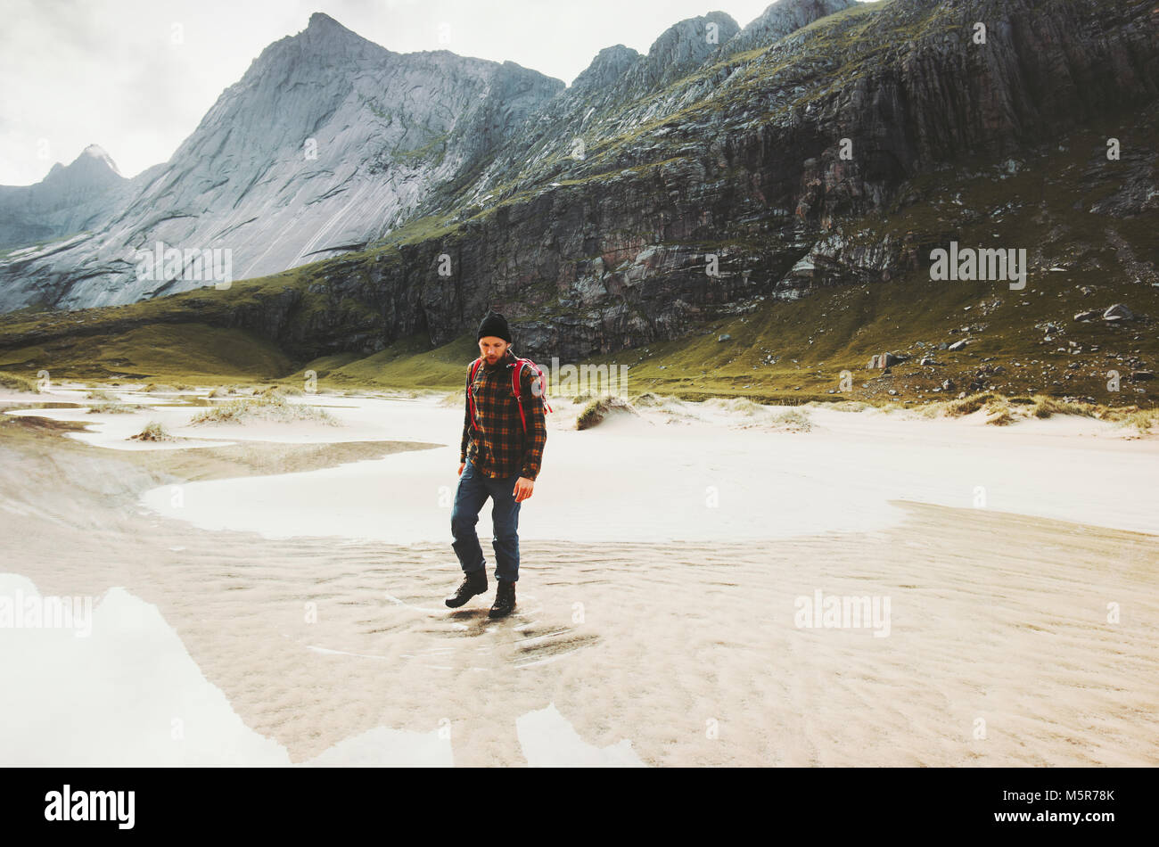 Tourist Man walking alone in mountains Travel lifestyle wanderlust ...