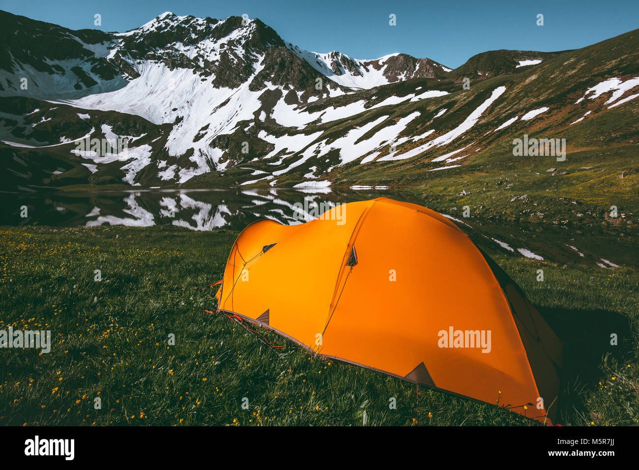 Orange camping tent in mountains landscape Travel Lifestyle concept ...