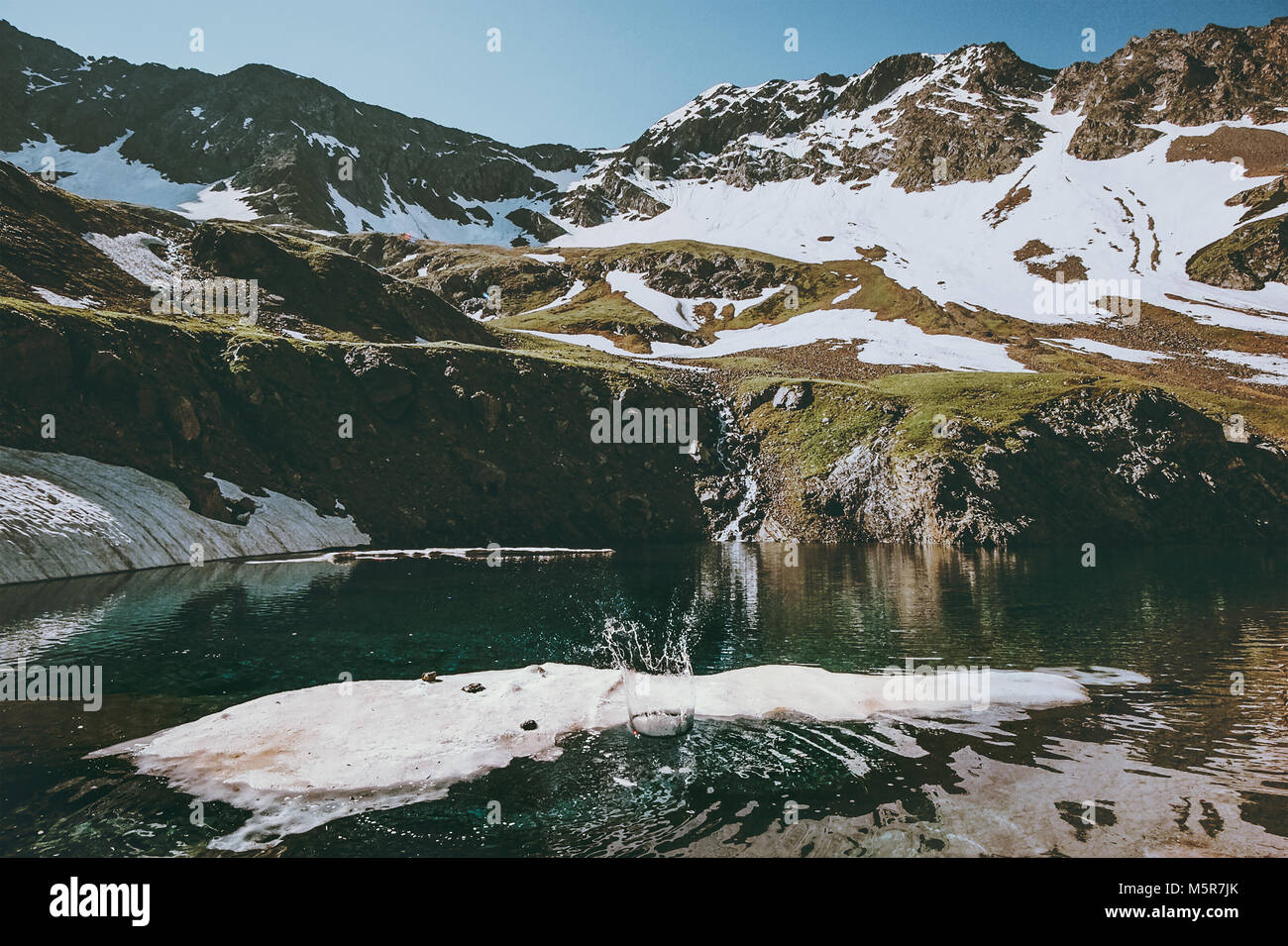 Lake in mountains with water splash landscape outdoor wild nature ...