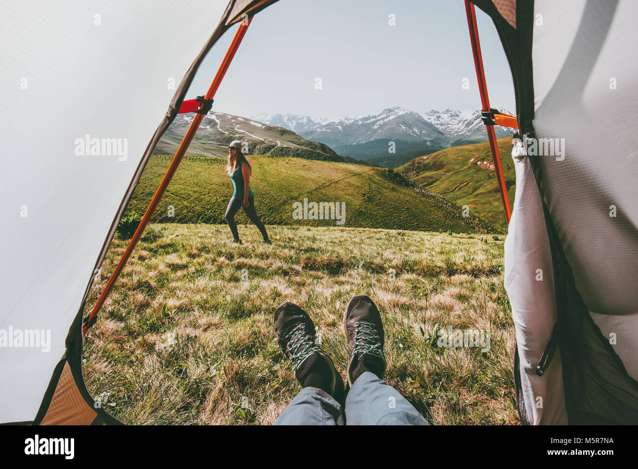 Camping couple traveling view from tent entrance woman walking in ...
