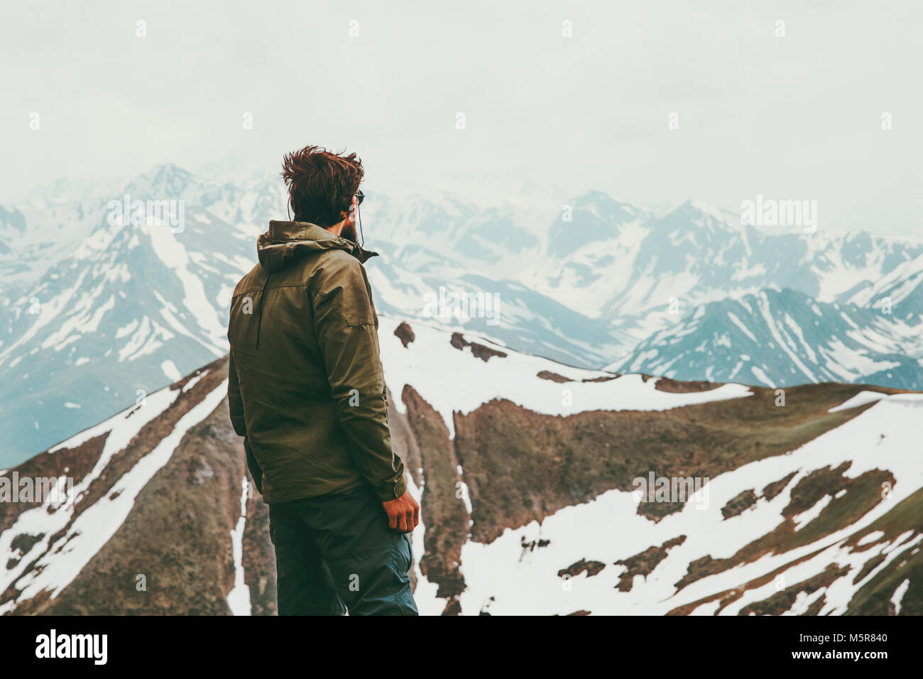 Man traveler alone wander mountains landscape Travel Lifestyle concept ...