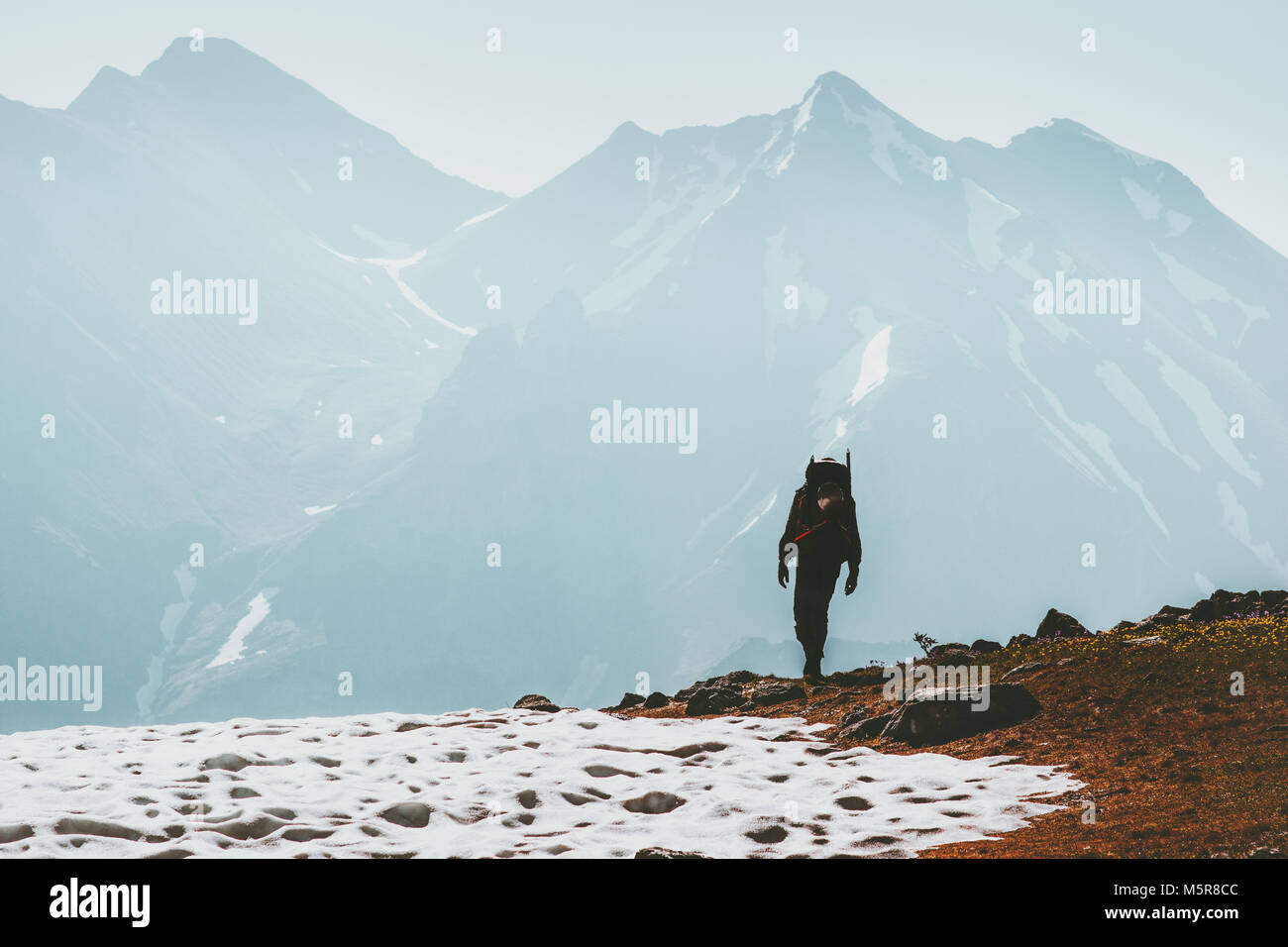 Traveler Man hiking in mountains Lifestyle travel survival concept ...