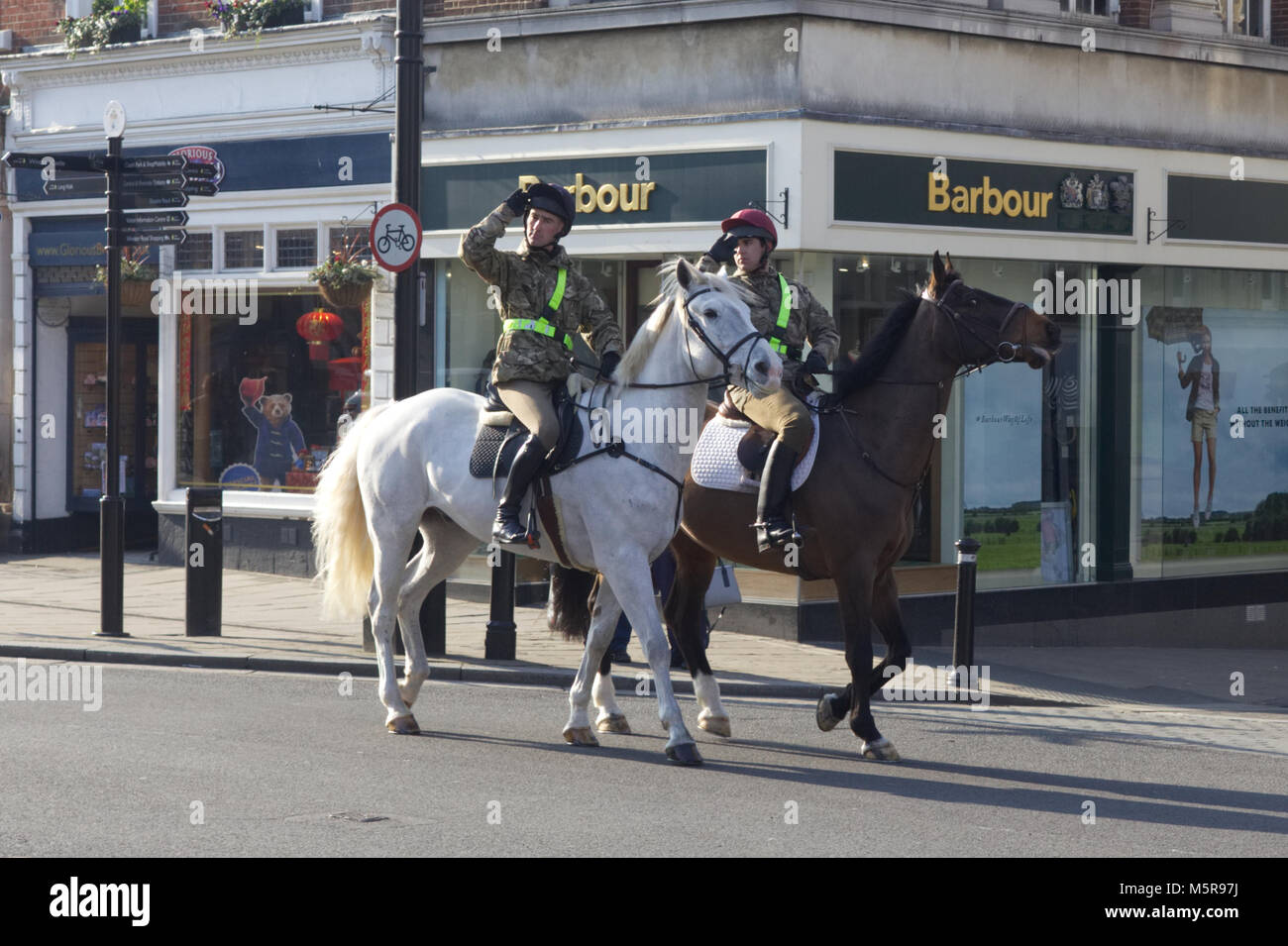 Mounted troops saluting the statute of Queen Victoria in Windsor Stock ...