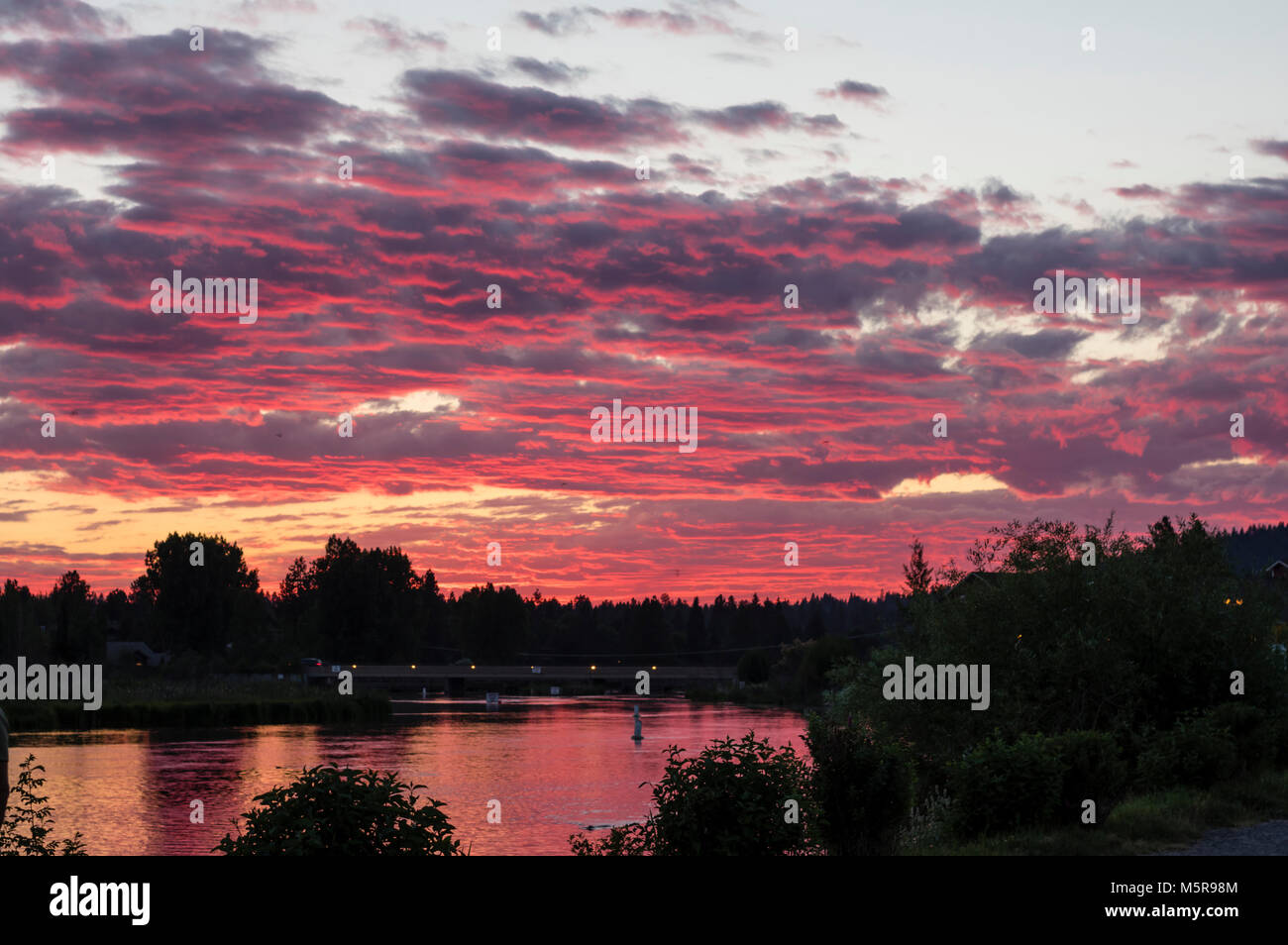 Brilliant neon looking sunset sky with the Deshutes River. Bend, Oregon ...