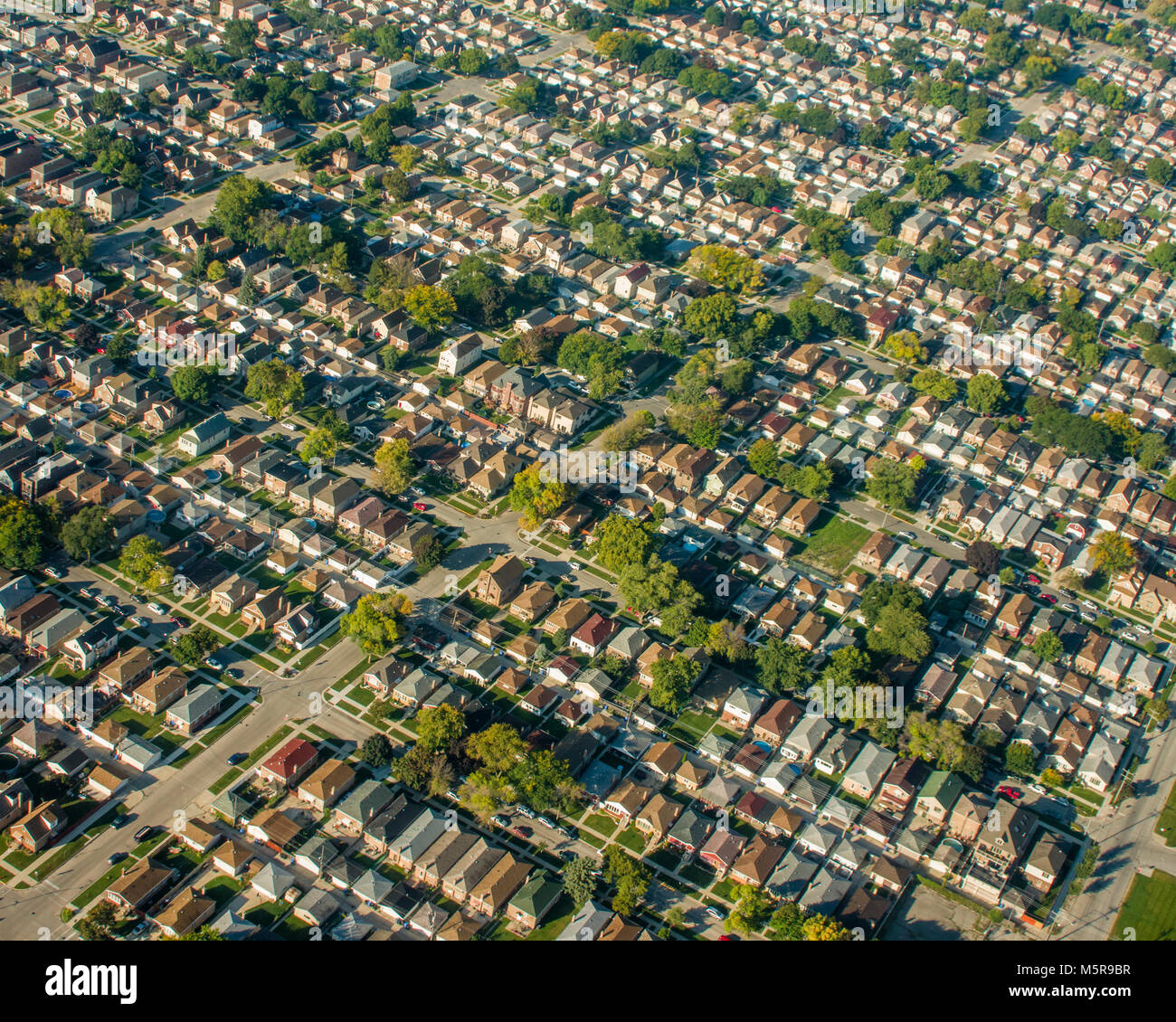 Aerial view of typical suburban neighborhood with densely packed houses ...