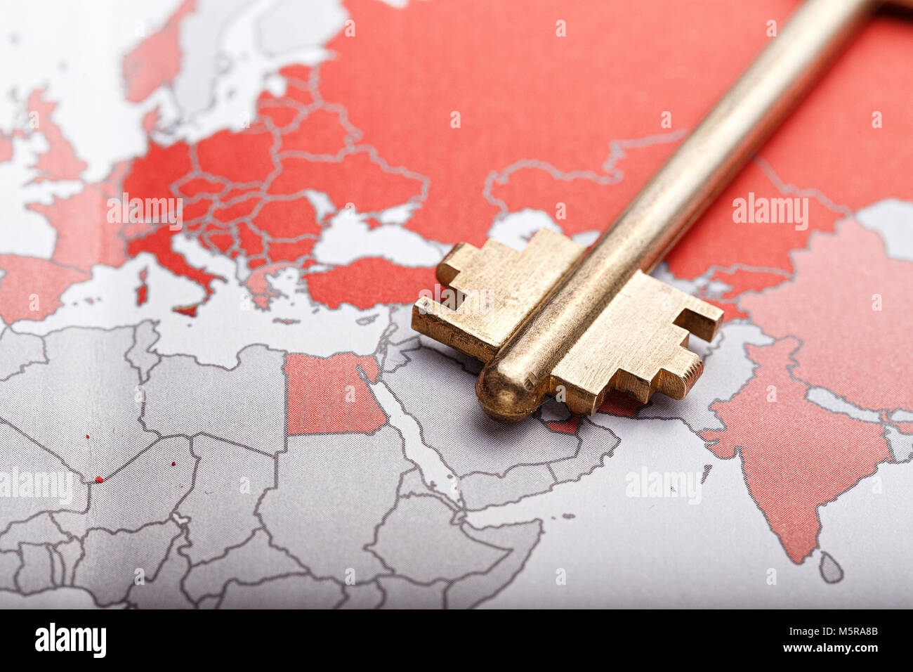 Gold color key on the world map, horizontal photo Stock Photo - Alamy