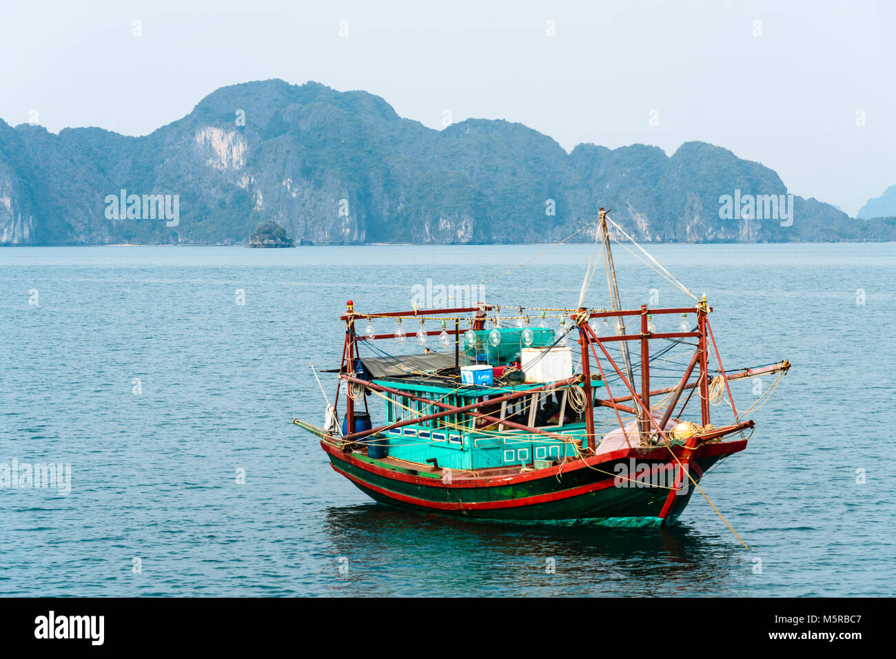 Traditional fishing boat on Halong Bay, Vietnam Stock Photo - Alamy