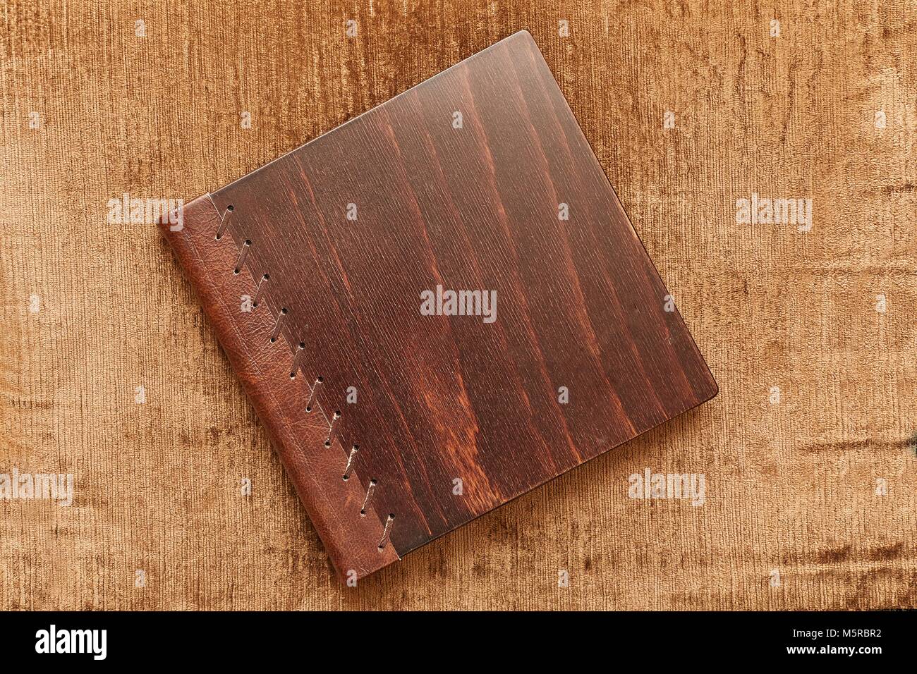 Note book with hard wooden cover Stock Photo - Alamy