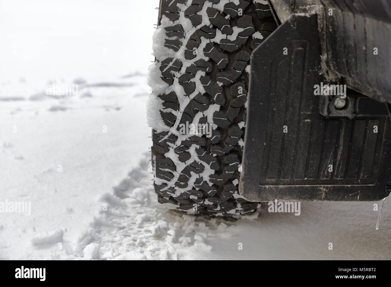 Car tyre in snow Stock Photo - Alamy