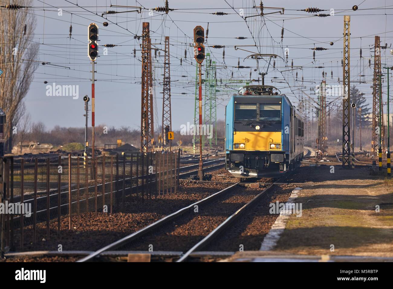 Train arriving at a station Stock Photo - Alamy