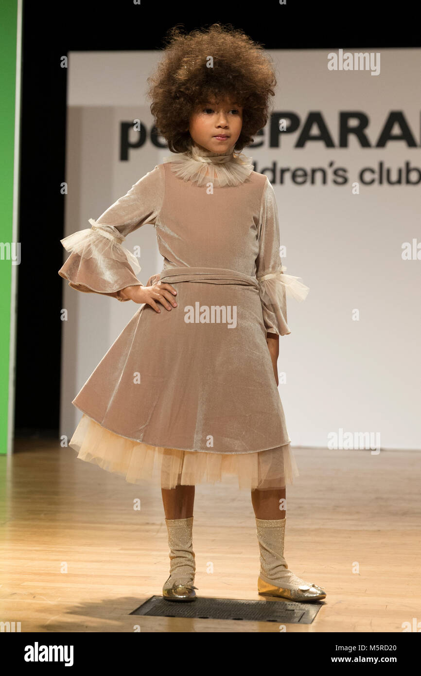 New York, NY - February 25, 2018: Young model shows off dresses by ...