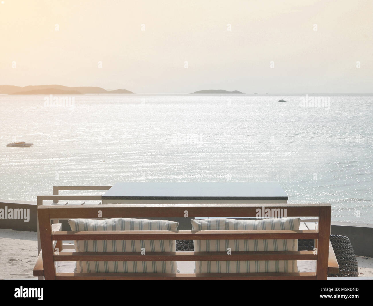 Table set on the beach facing ocean view from very high point of view ...