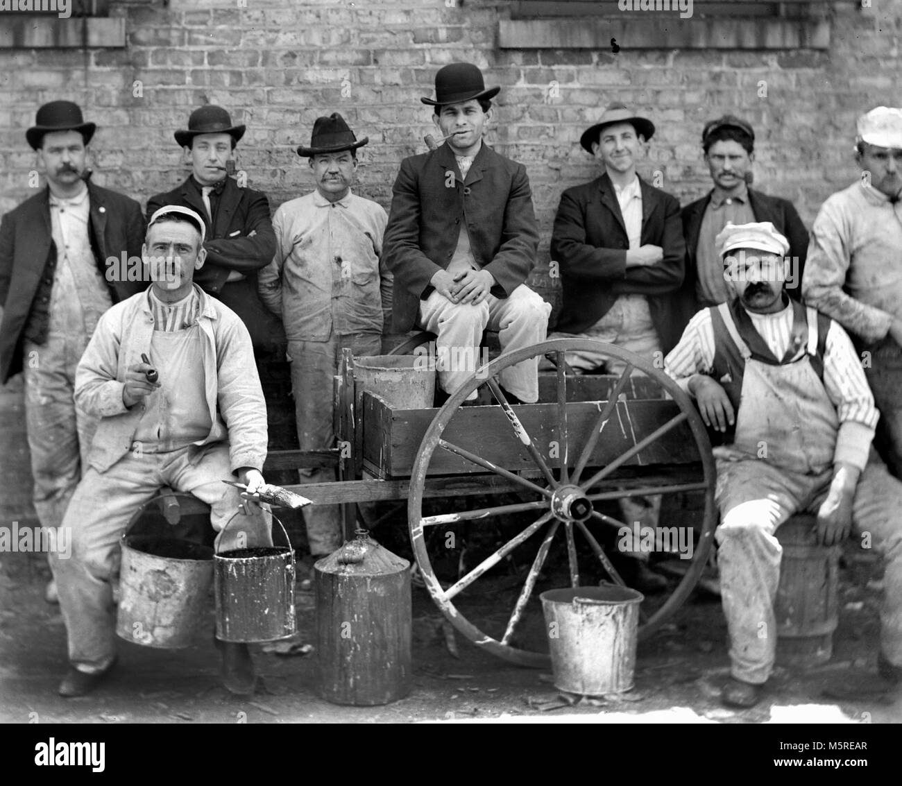 A painting crew takes time out for team portrait at the beginning of ...