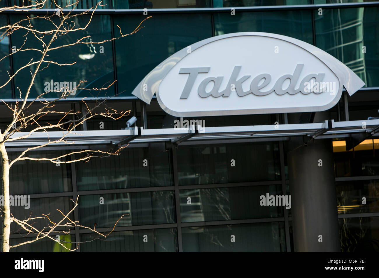 A logo sign outside of a facility occupied by Takeda Pharmaceutical ...
