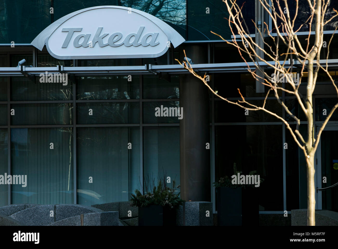 A logo sign outside of a facility occupied by Takeda Pharmaceutical ...