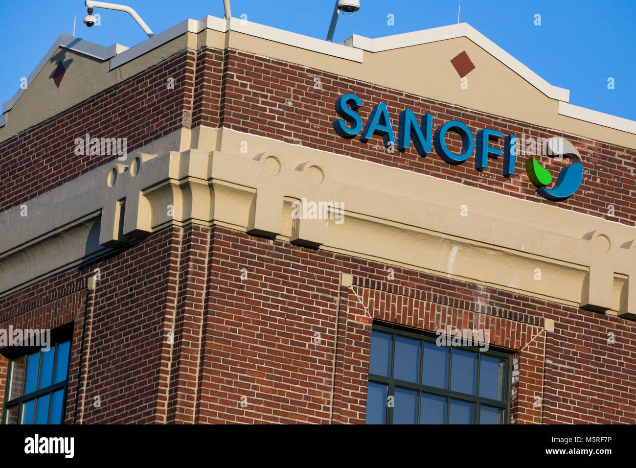 A logo sign outside of a facility occupied by Sanofi in Cambridge ...