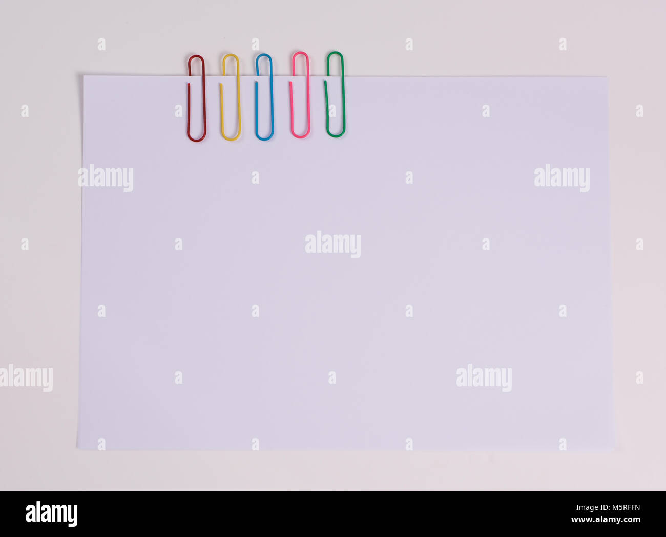 A4 paper and attached paperclips Stock Photo - Alamy
