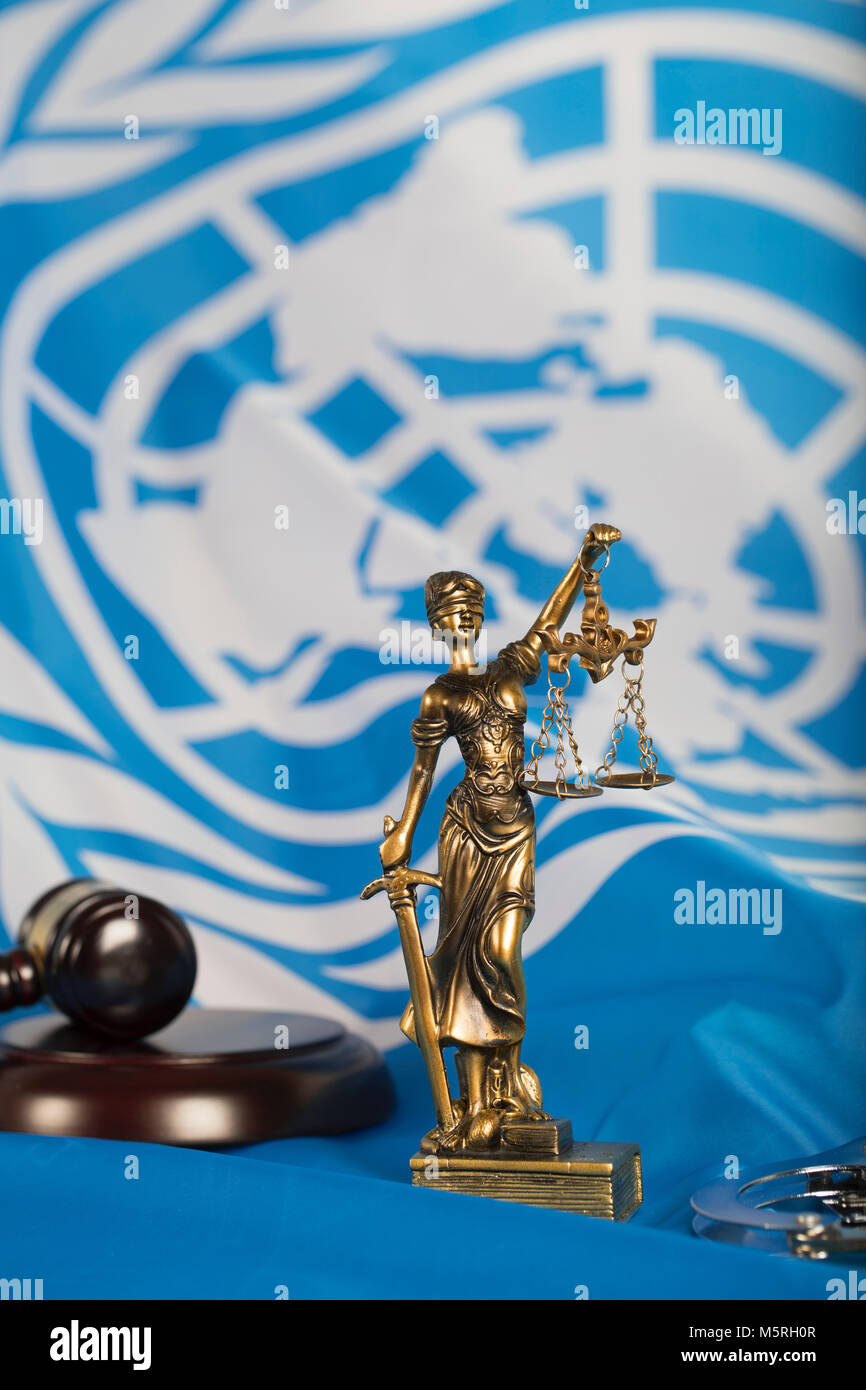 Statue of ancient Greek Titaness - Themis on a flag of United Nations ...