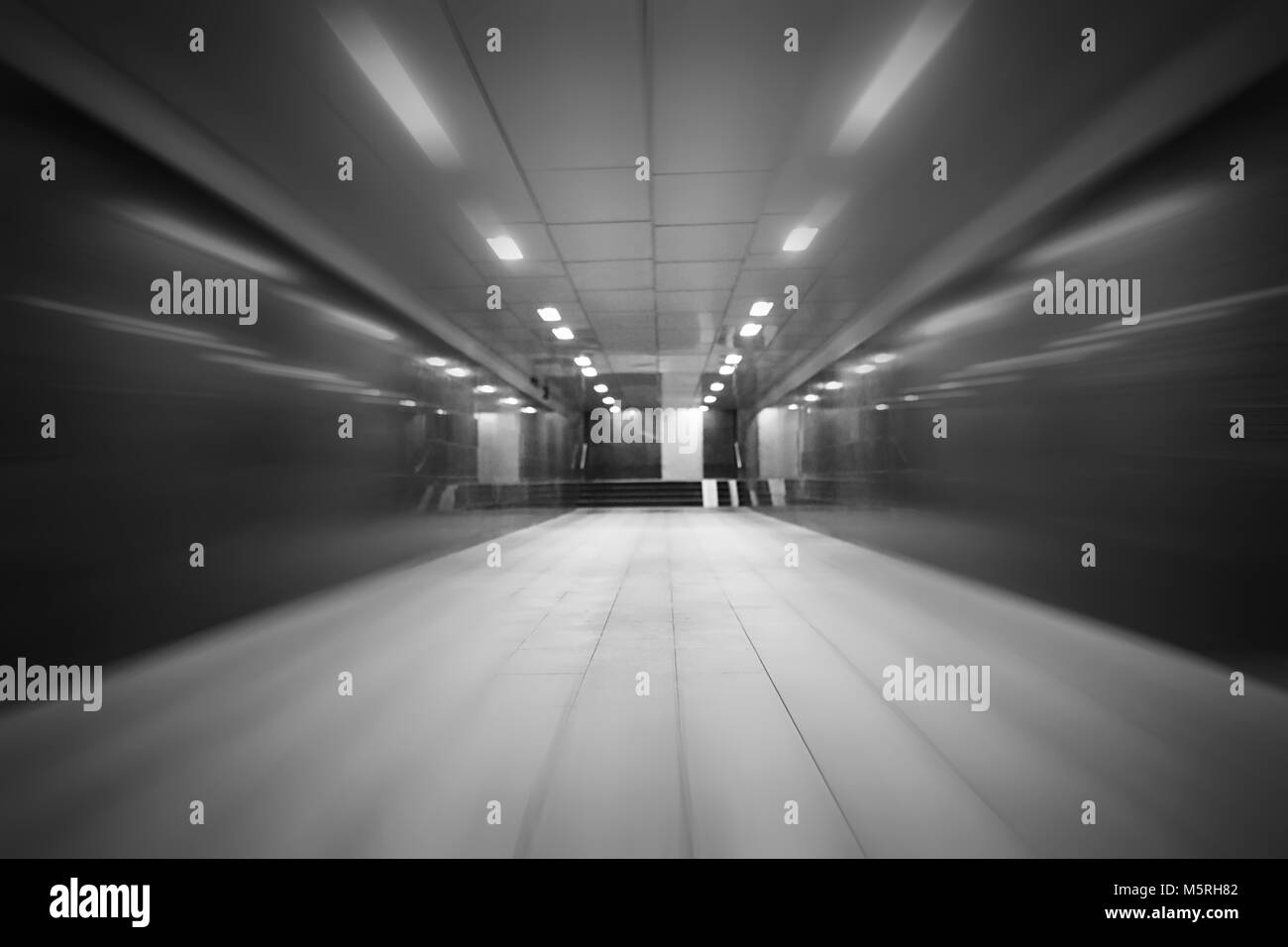 underground passage with lights blur background Stock Photo - Alamy