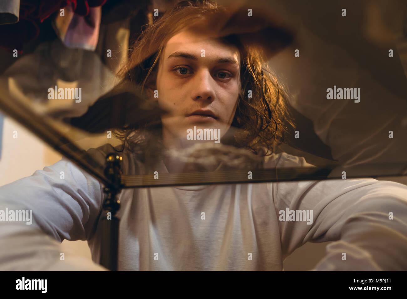 Addicted teenage boy experiencing psychotropic effects Stock Photo - Alamy