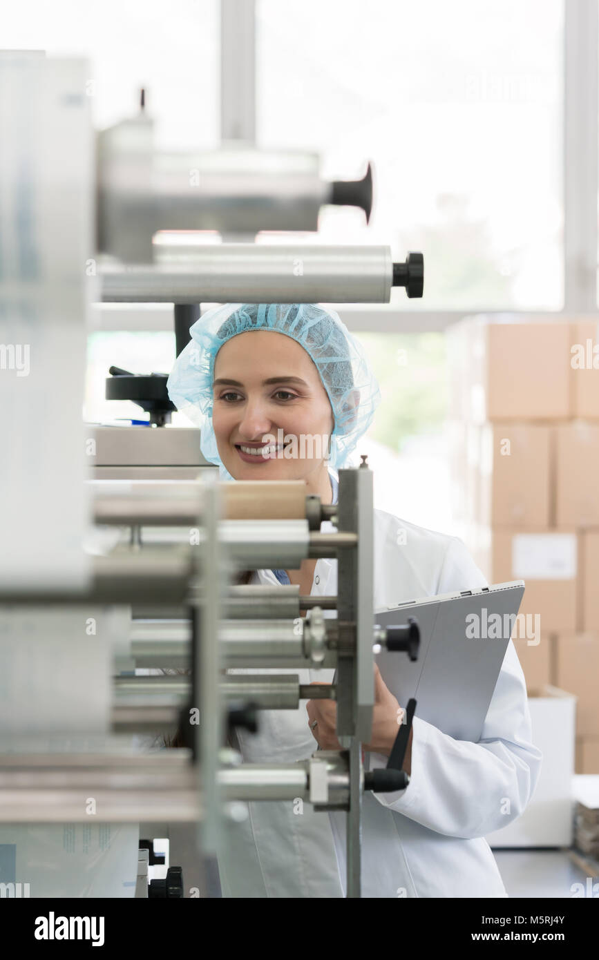 Manufacturing supervisor looking worried during quality control Stock ...