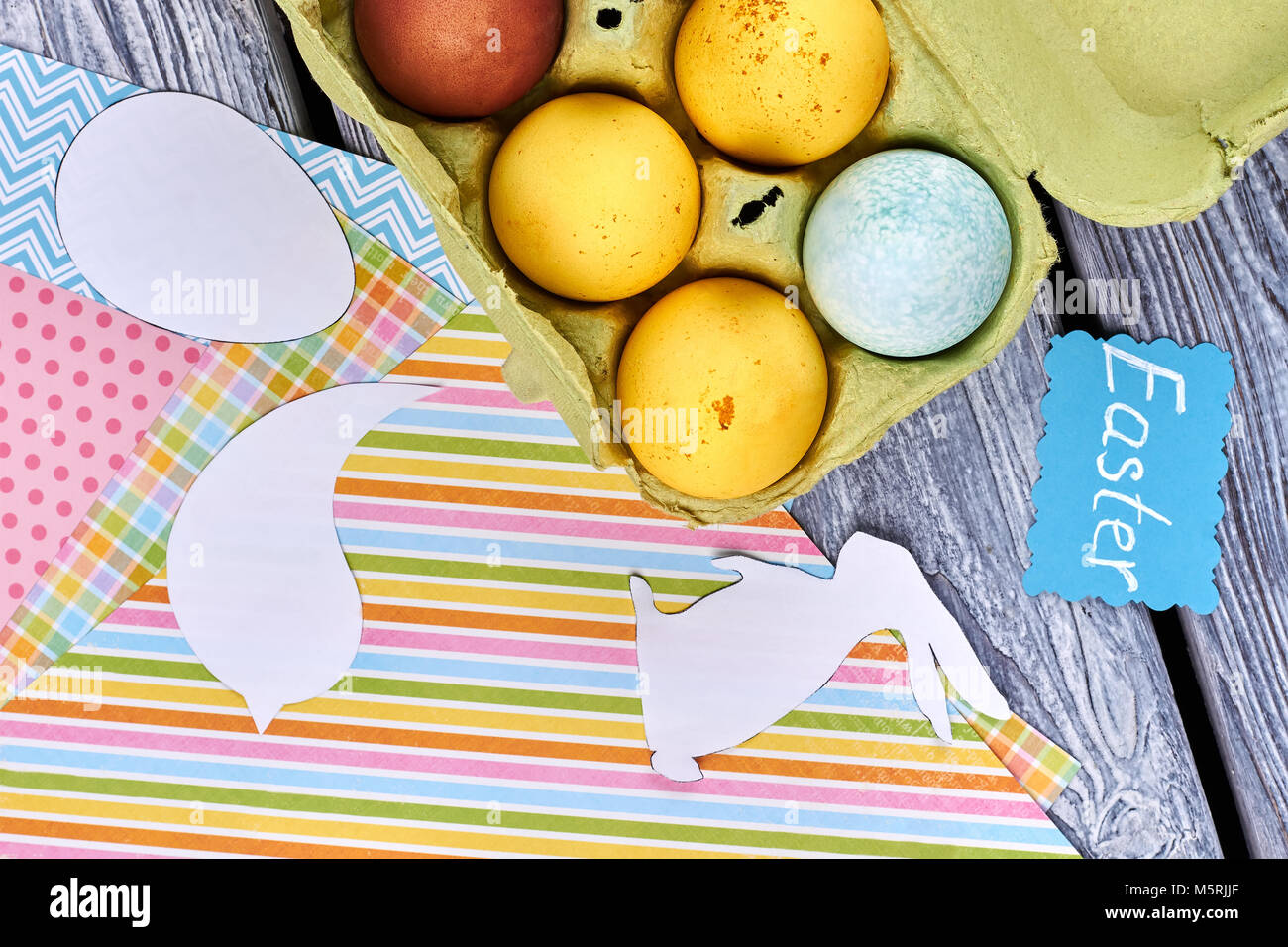 Easter eggs and paper festive cutouts Stock Photo - Alamy
