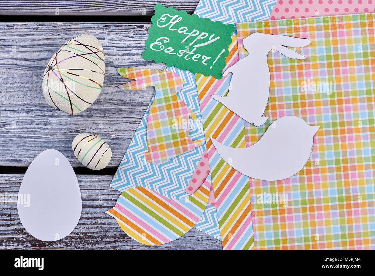 Easter greeting card and colorful paper Stock Photo - Alamy