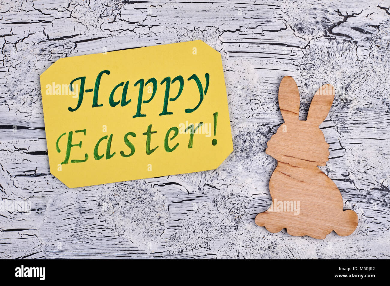 Happy Easter message and wooden rabbit Stock Photo - Alamy