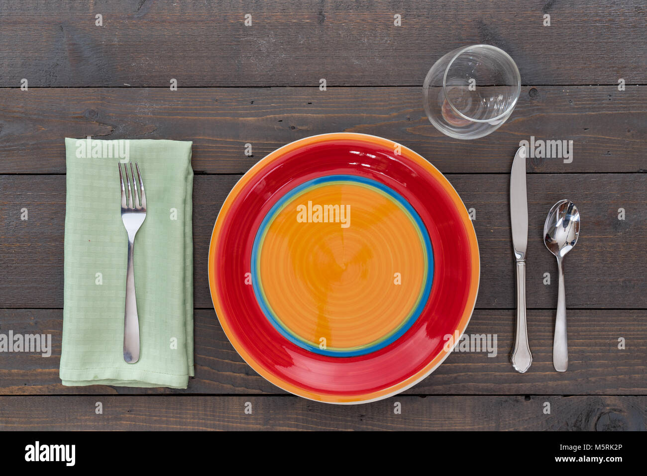 Dining place setting on a rustic wood background Stock Photo - Alamy