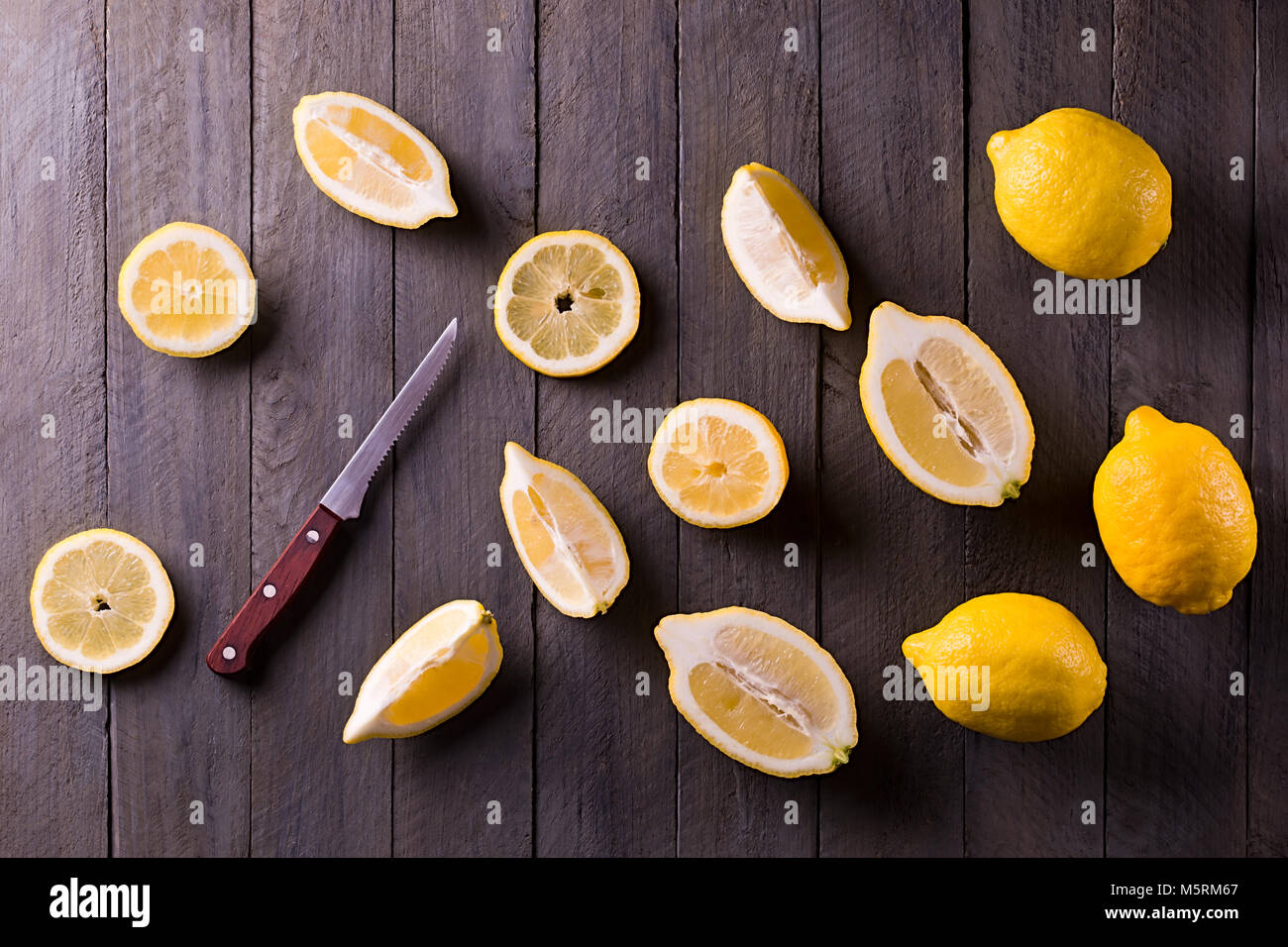 Fresh lemons on rustic wooden background Stock Photo - Alamy