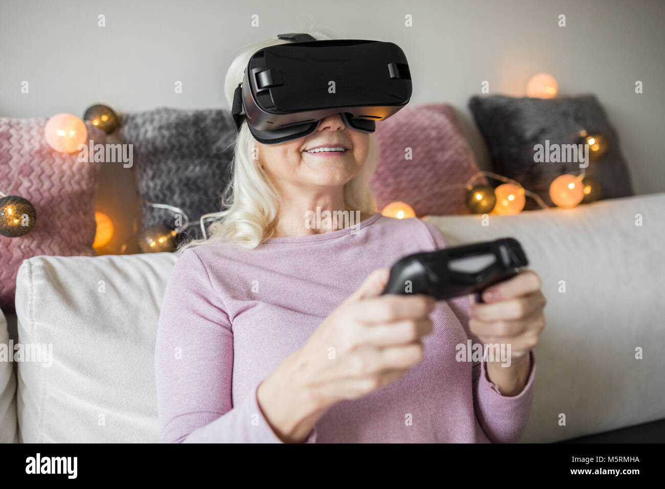 Vr mature senior woman headset hi-res stock photography and images - Alamy