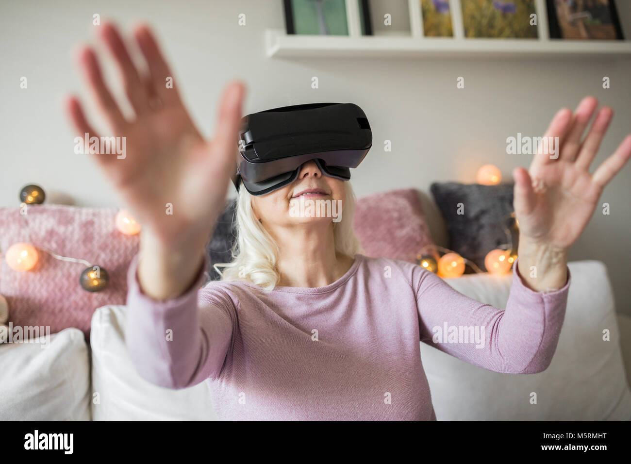 Vr mature senior woman headset hi-res stock photography and images - Alamy