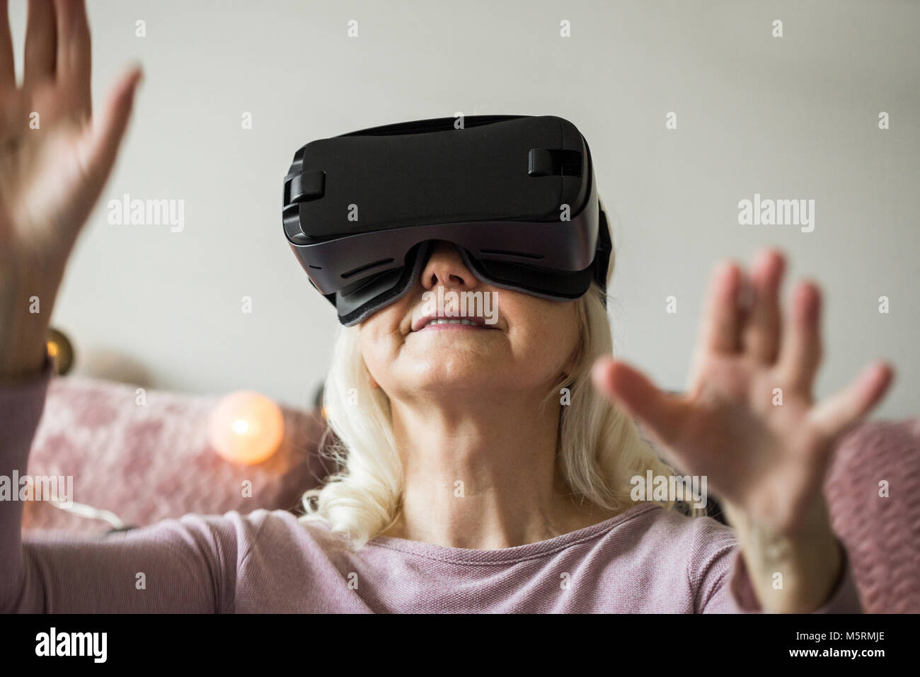 Vr mature senior woman headset hi-res stock photography and images - Alamy