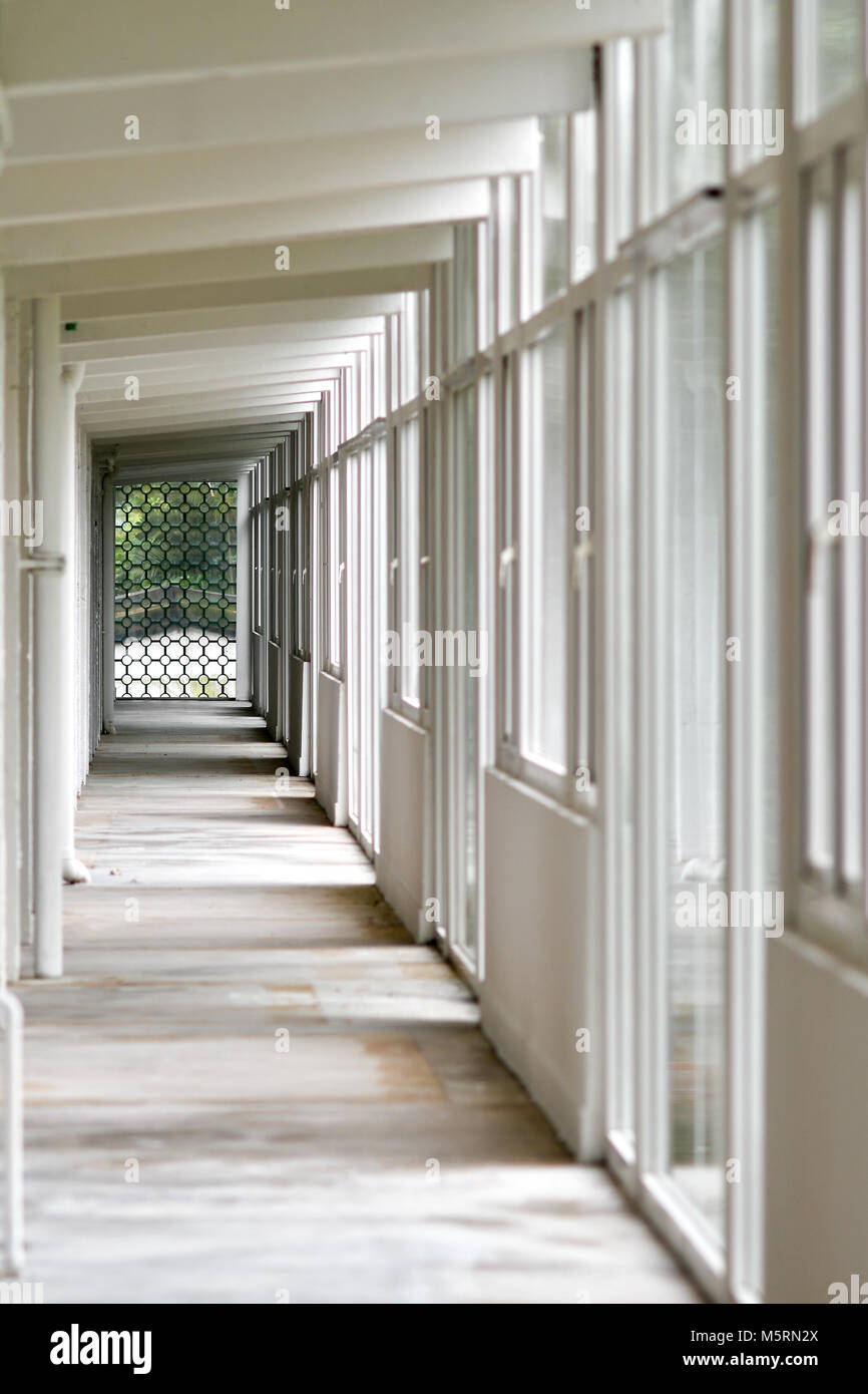 White interior building with windows and pillars Stock Photo - Alamy