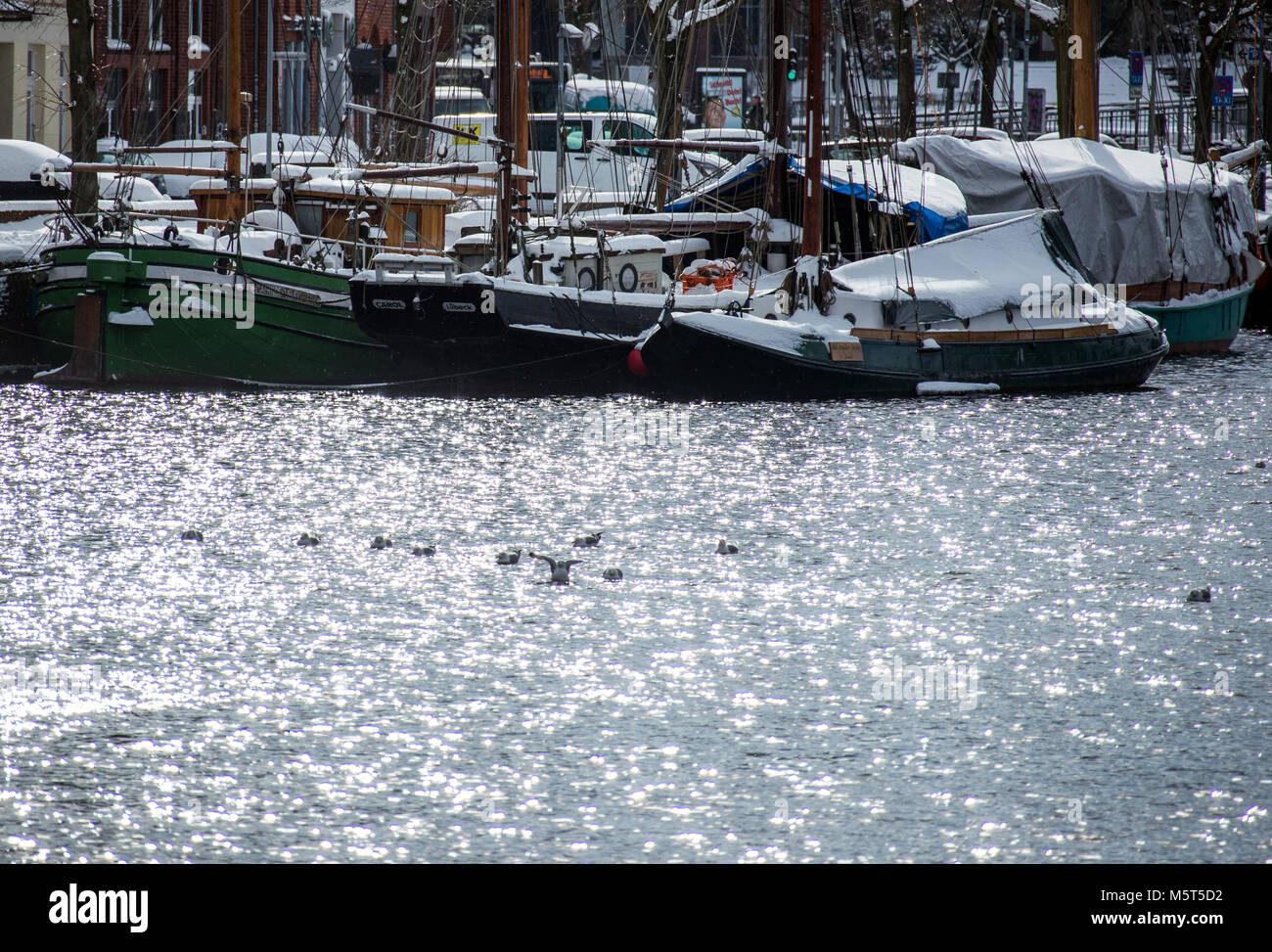 26 February 2018, Germany, Luebeck: Snow covers historical sailing ...