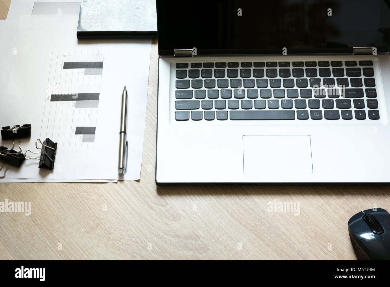 Corporate identity mock up on desk with laptop and documentation with ...