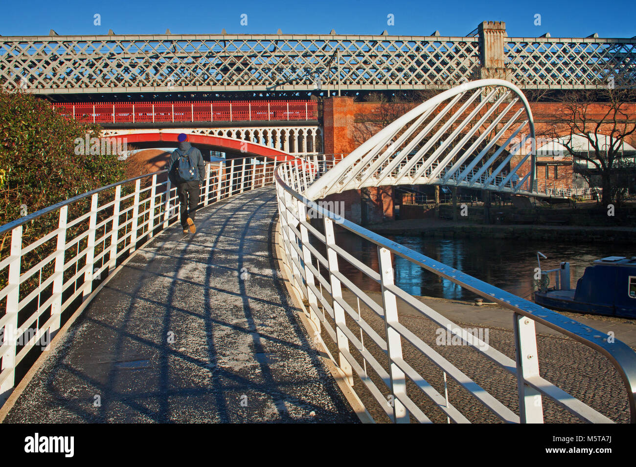 Crossing merchants' bridge at Castlefield, Manchester Stock Photo - Alamy