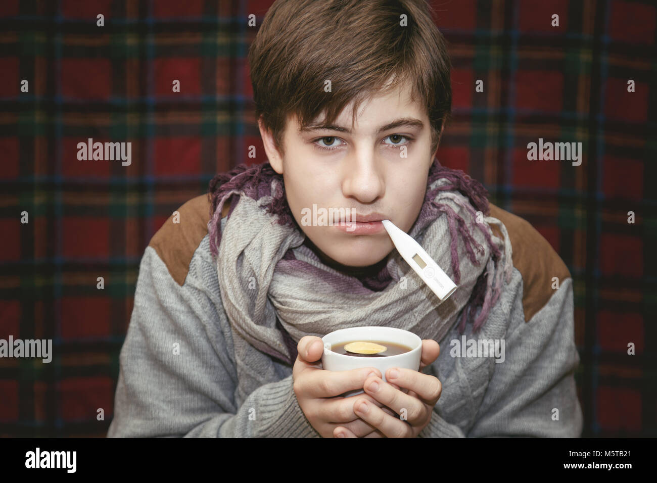 Teenager fever thermometer hi-res stock photography and images - Alamy