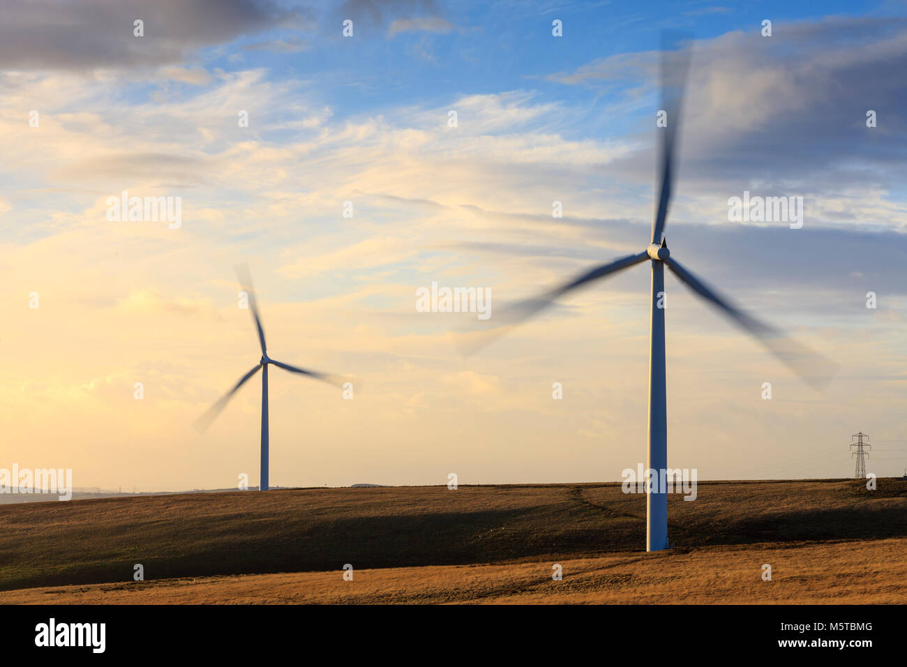 Wind turbine and electricity pylon Mynydd y Betws wind farm Amman and ...