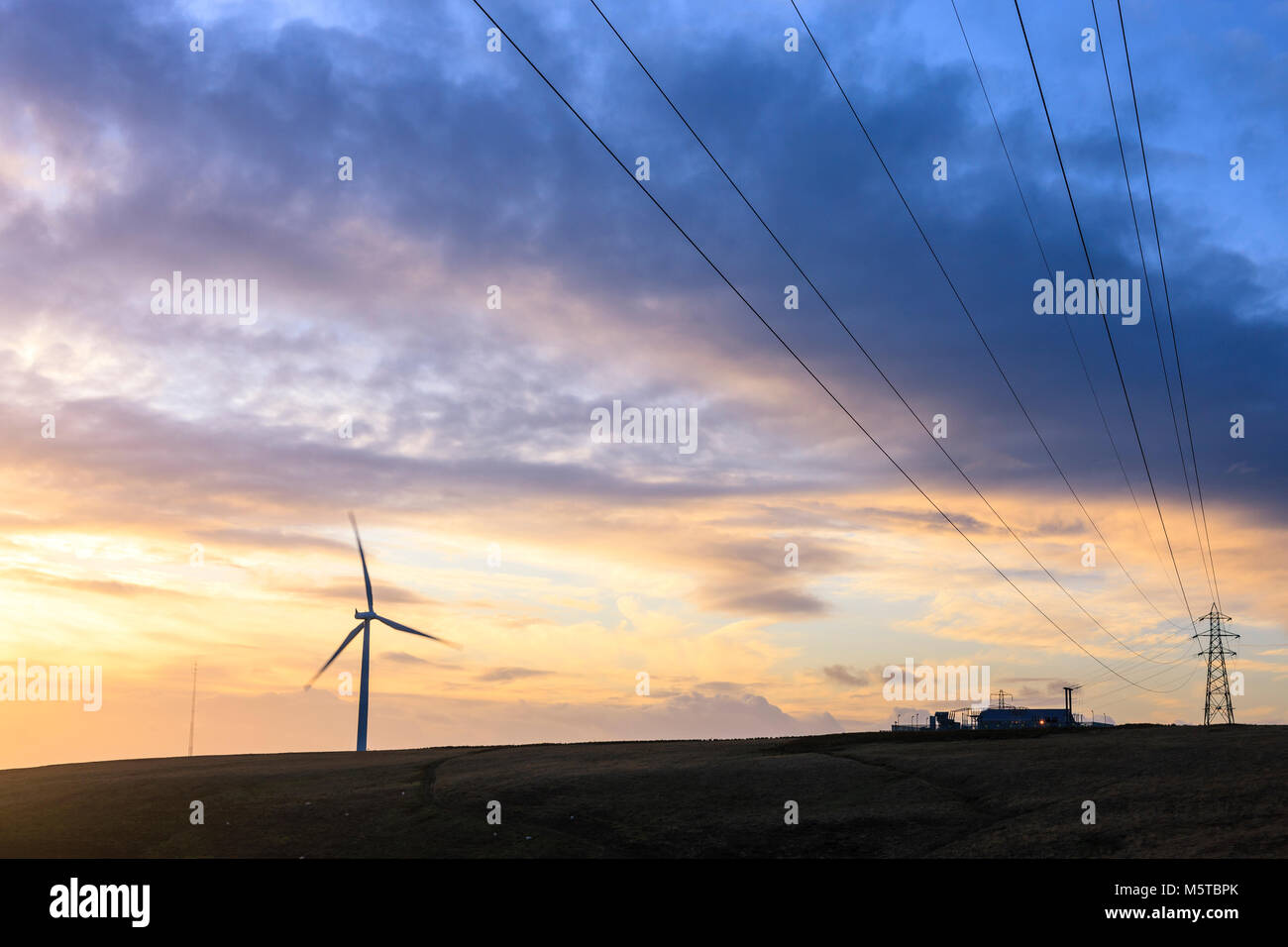 Wind turbine and electricity pylon Mynydd y Betws wind farm Amman and ...
