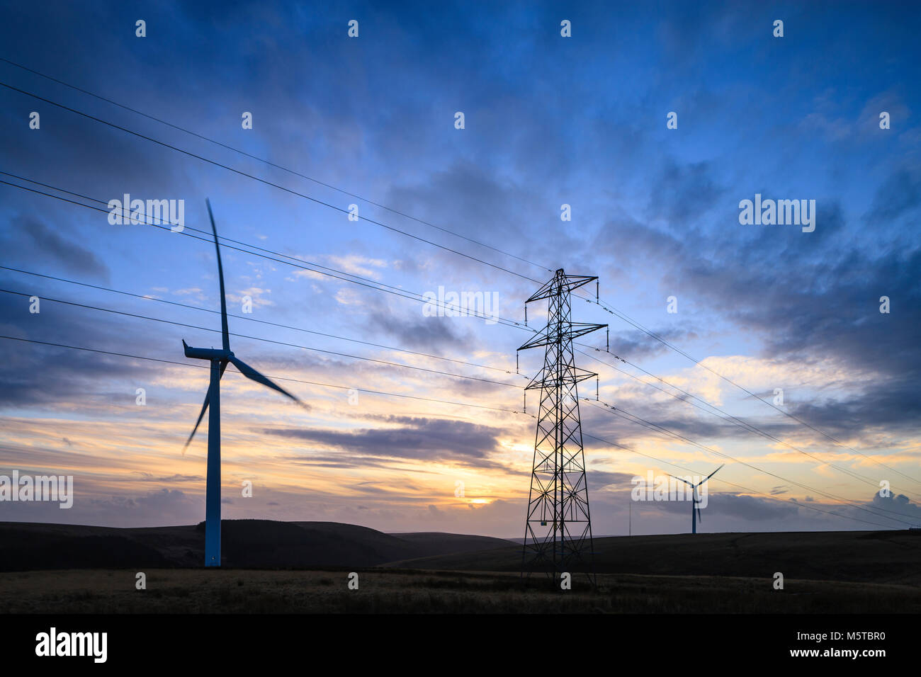 Wind turbine and electricity pylon Mynydd y Betws wind farm Amman and ...